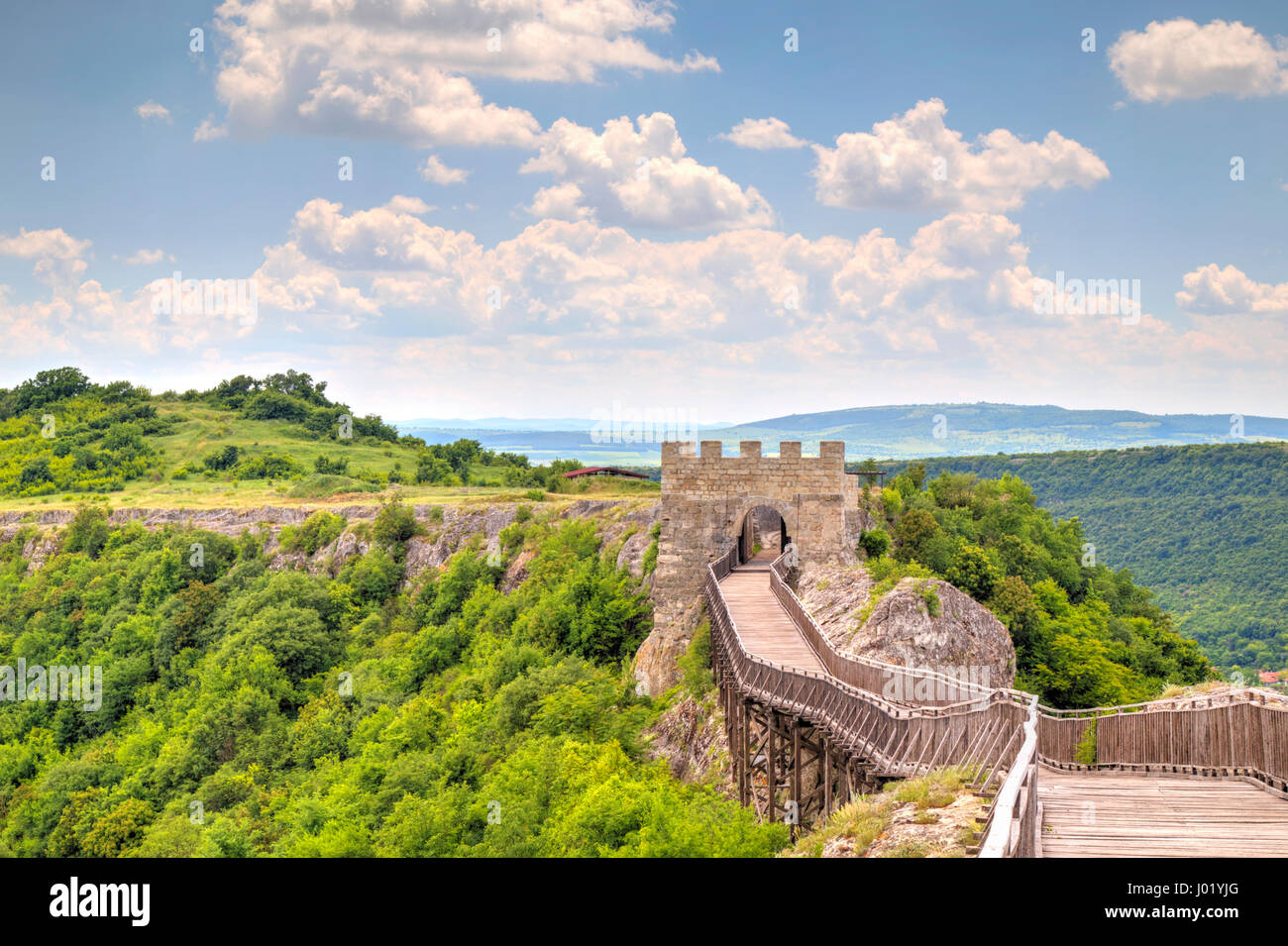 Stone walls and gate with wooden bridge of medieval fortress Stock ...