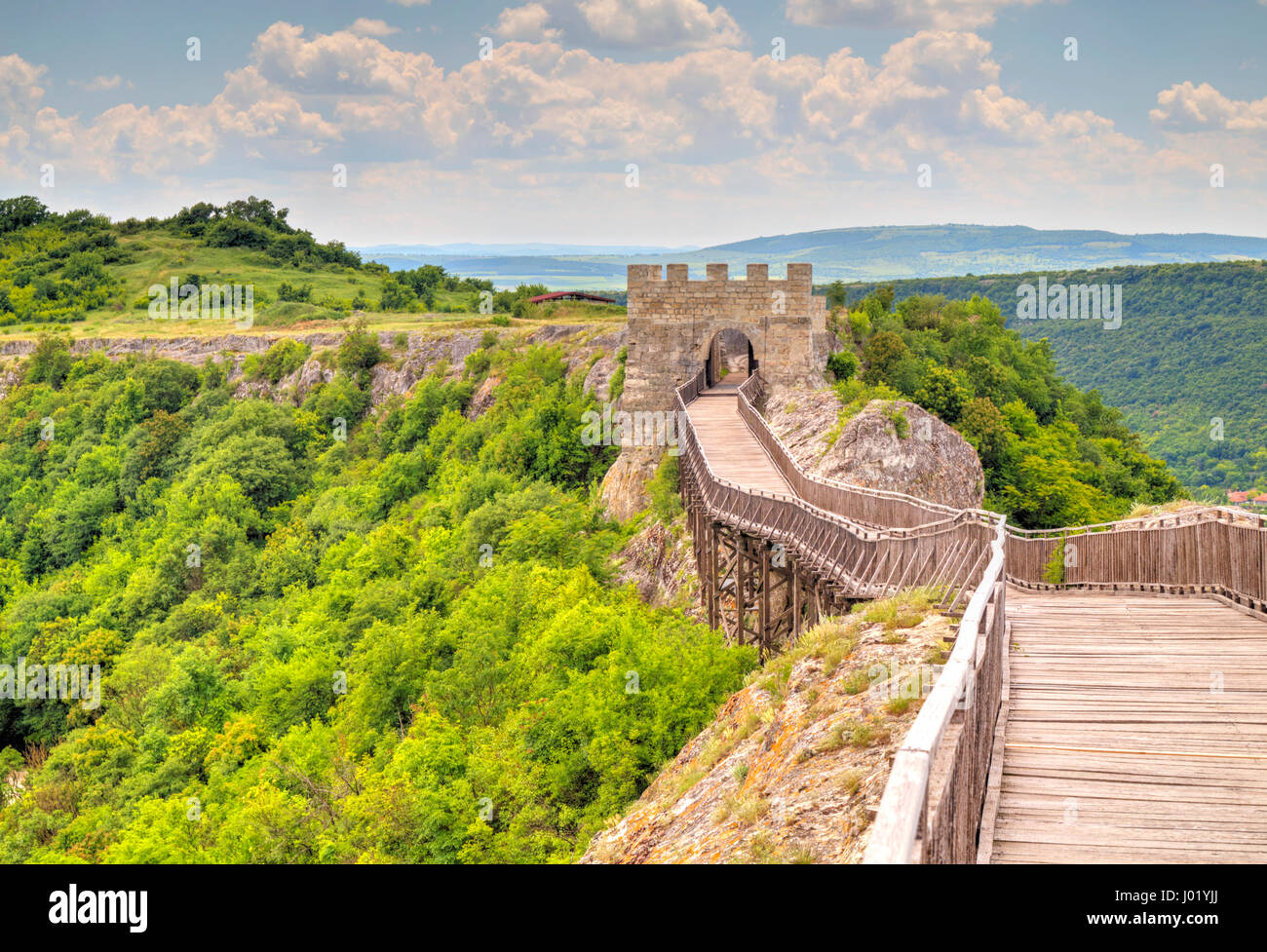 Stone walls and gate with wooden bridge of medieval fortress Stock ...