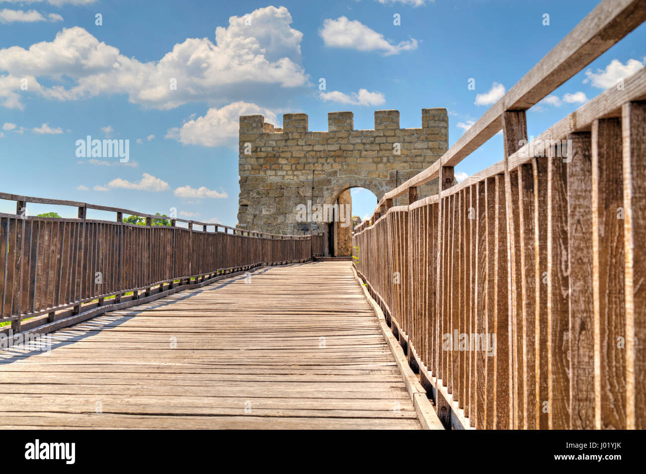 Stone walls and gate with wooden bridge of medieval fortress Stock ...