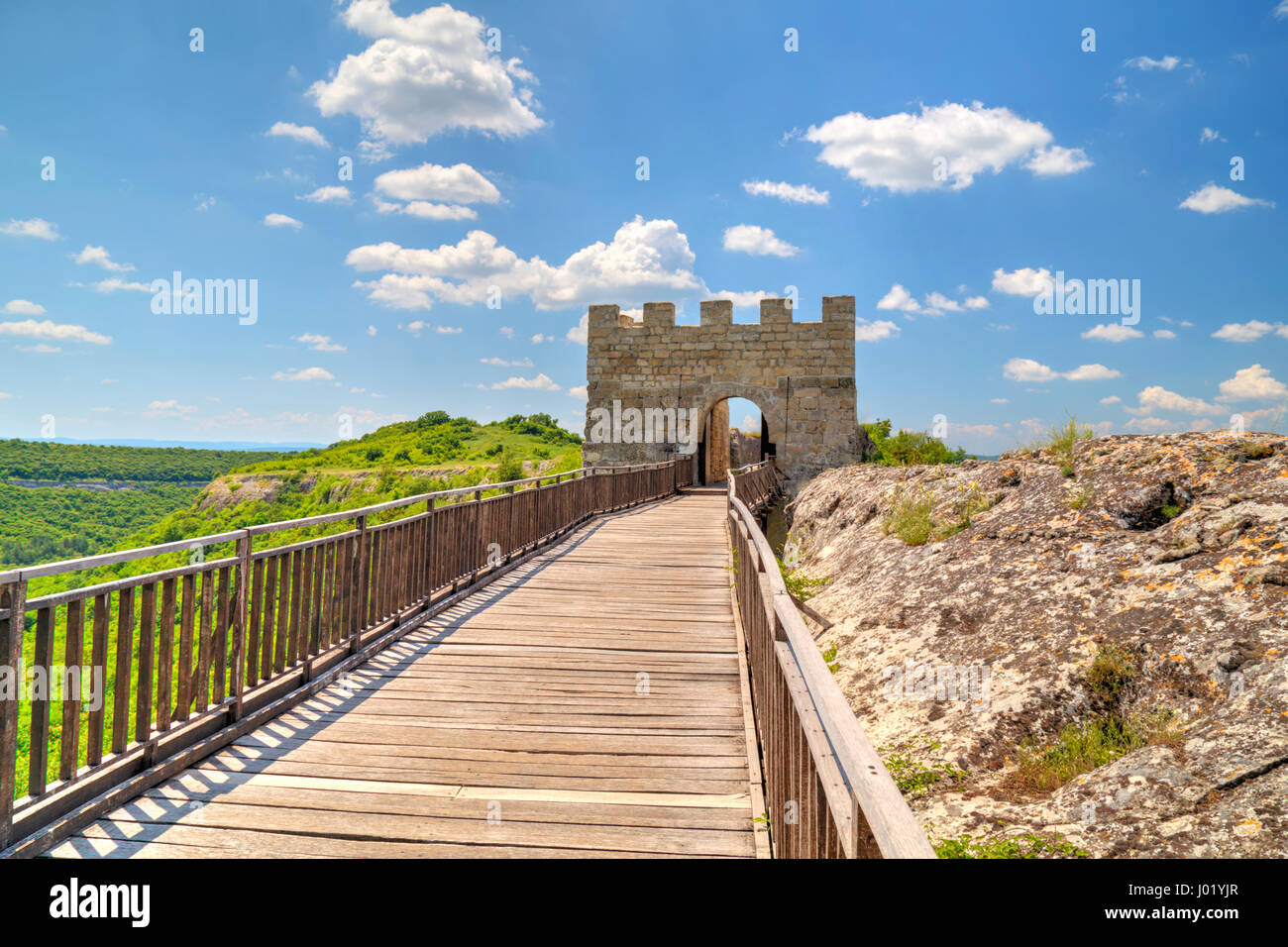 Stone walls and gate with wooden bridge of medieval fortress Stock ...
