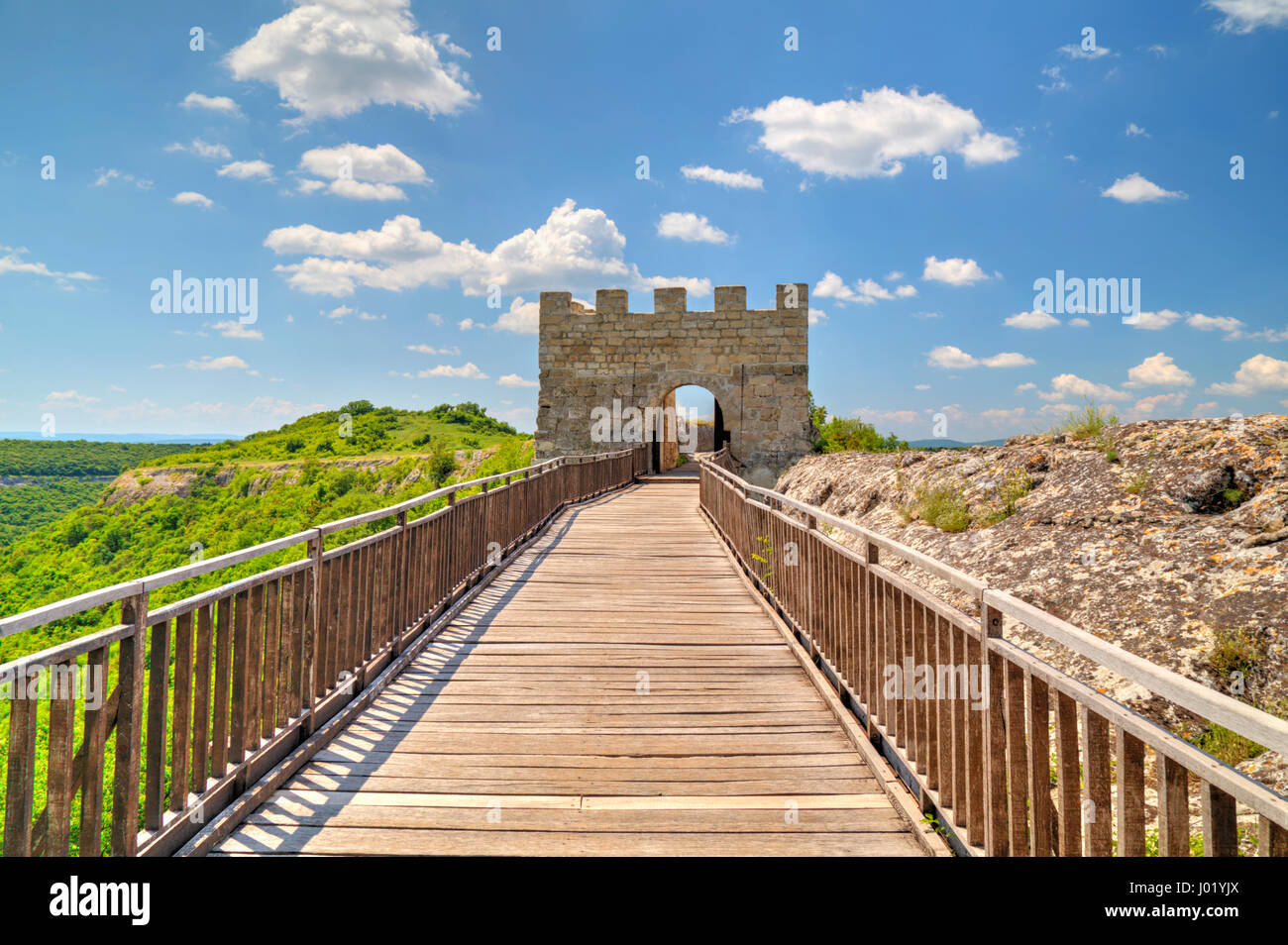 Stone walls and gate with wooden bridge of medieval fortress Stock ...