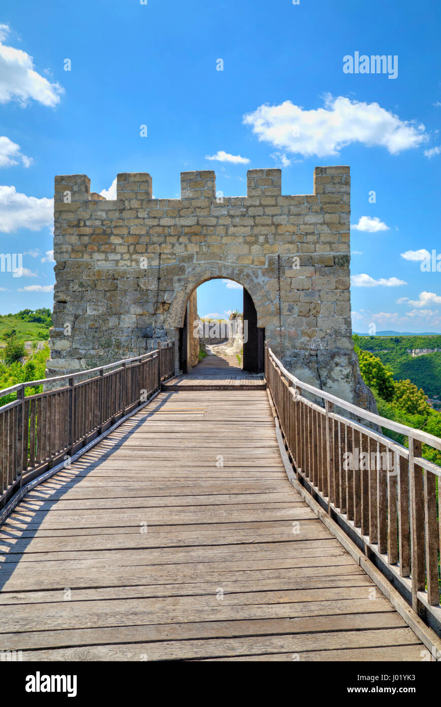 Stone walls and gate with wooden bridge of medieval fortress Stock ...