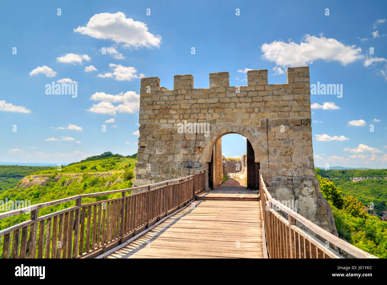 Stone walls and gate with wooden bridge of medieval fortress Stock ...