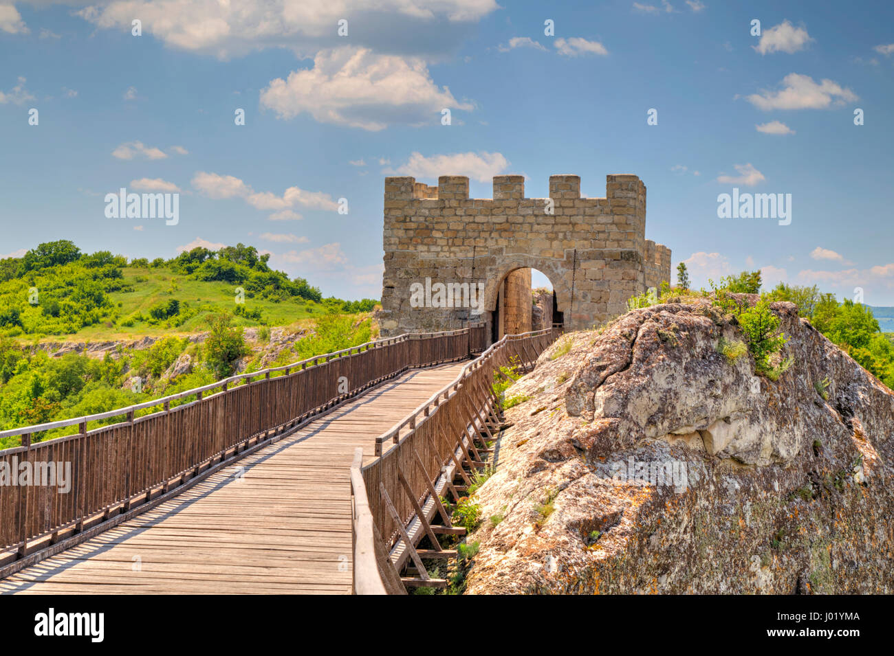Stone walls and gate with wooden bridge of medieval fortress Stock ...
