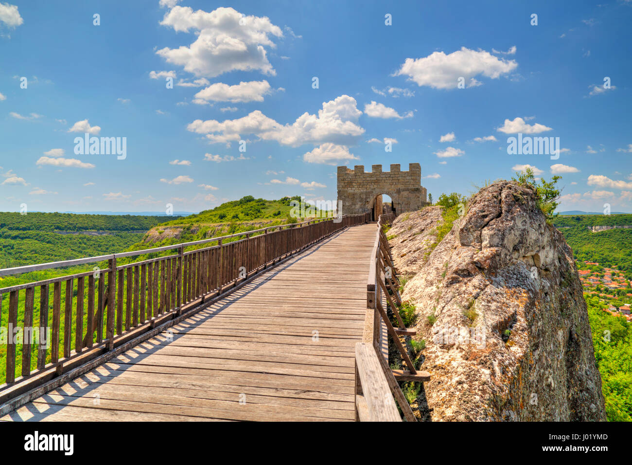 Stone walls and gate with wooden bridge of medieval fortress Stock ...