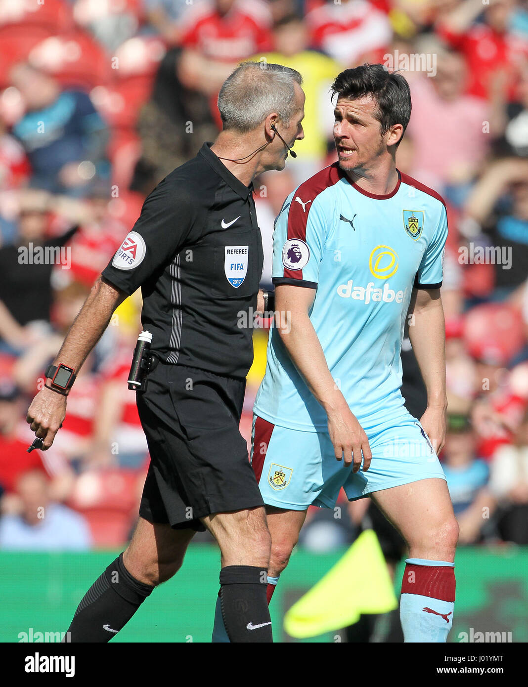 Burnley's Joey Barton speaks with referee Martin Atkinson during the ...