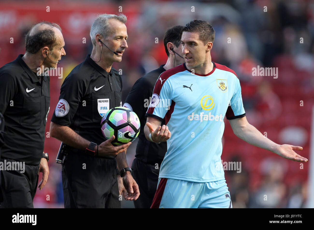 Burnley's Stephen Ward speaks with referee Martin Atkinson at half-time ...