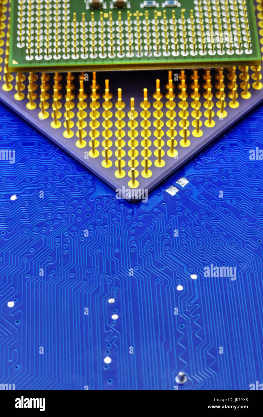 Technological background with blue computer motherboard and central ...