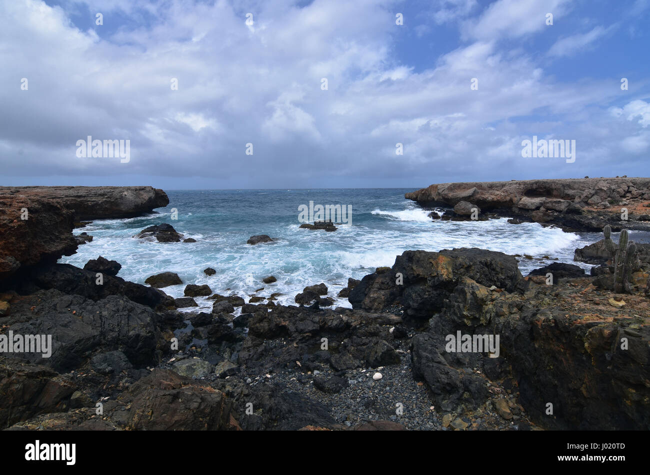 Rugged lava rock surrounding a cove on Aruba's eastern coast Stock ...