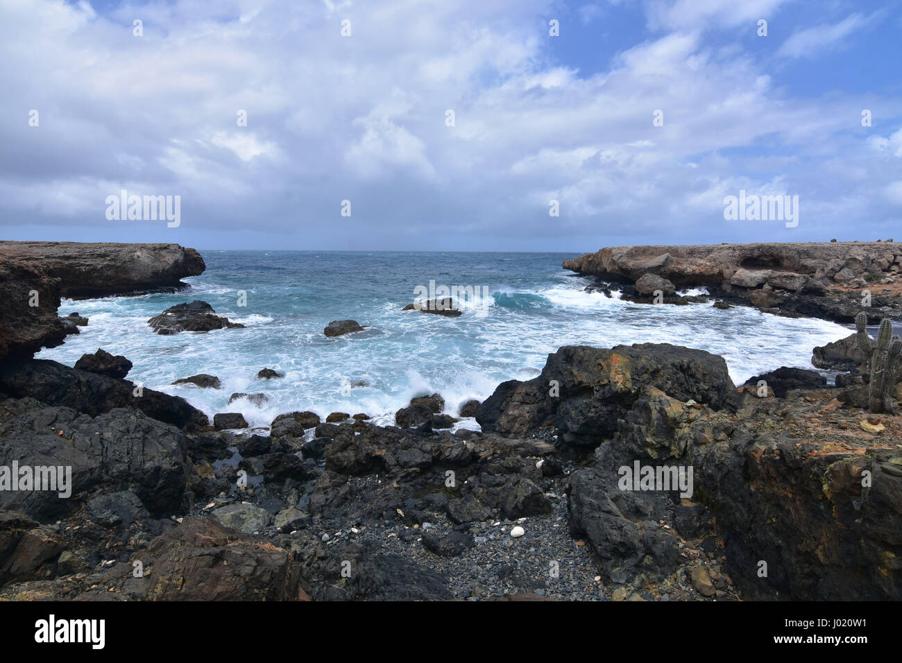 Lava rock along a beautiful cove on Aruba's Eastern shoreline Stock ...