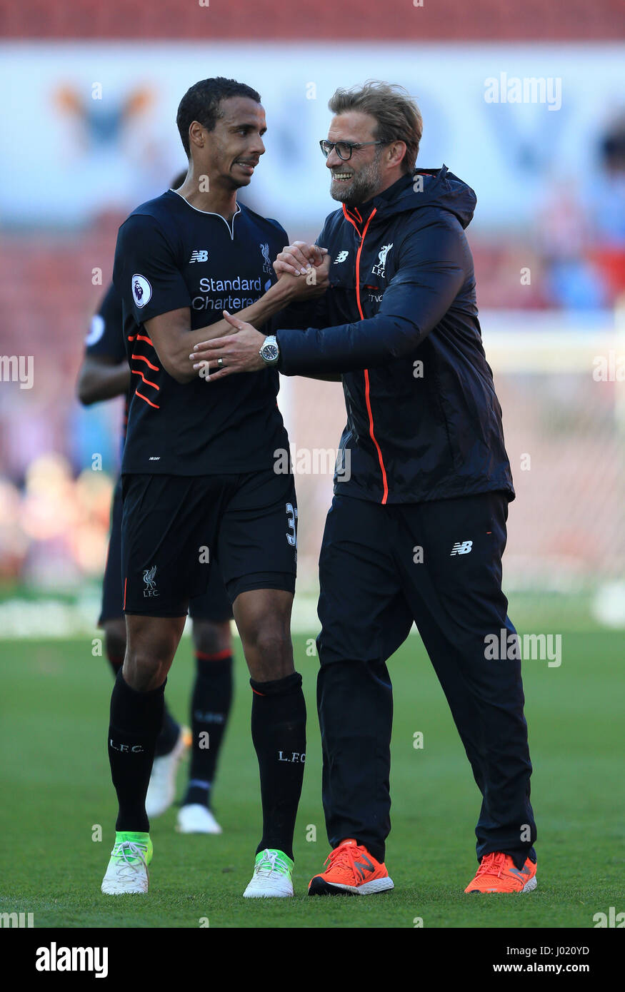 Liverpool manager Jurgen Klopp greets player Joel Matip after the final ...