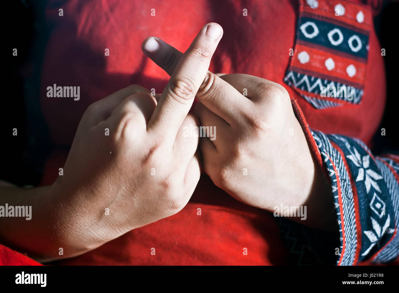 female wearing red, using sign language Stock Photo - Alamy