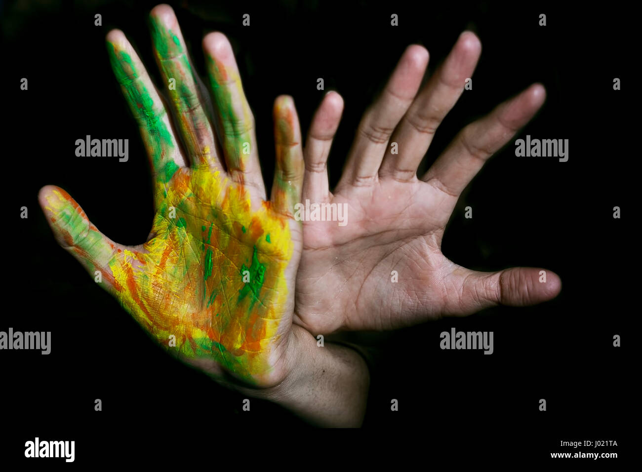 Human hands painted with poster color Stock Photo - Alamy