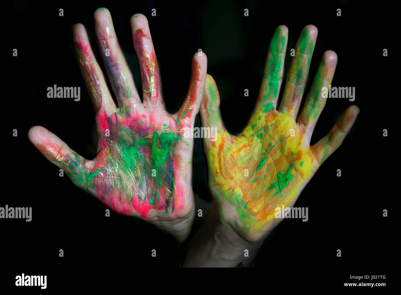 Human hands painted with poster color Stock Photo - Alamy