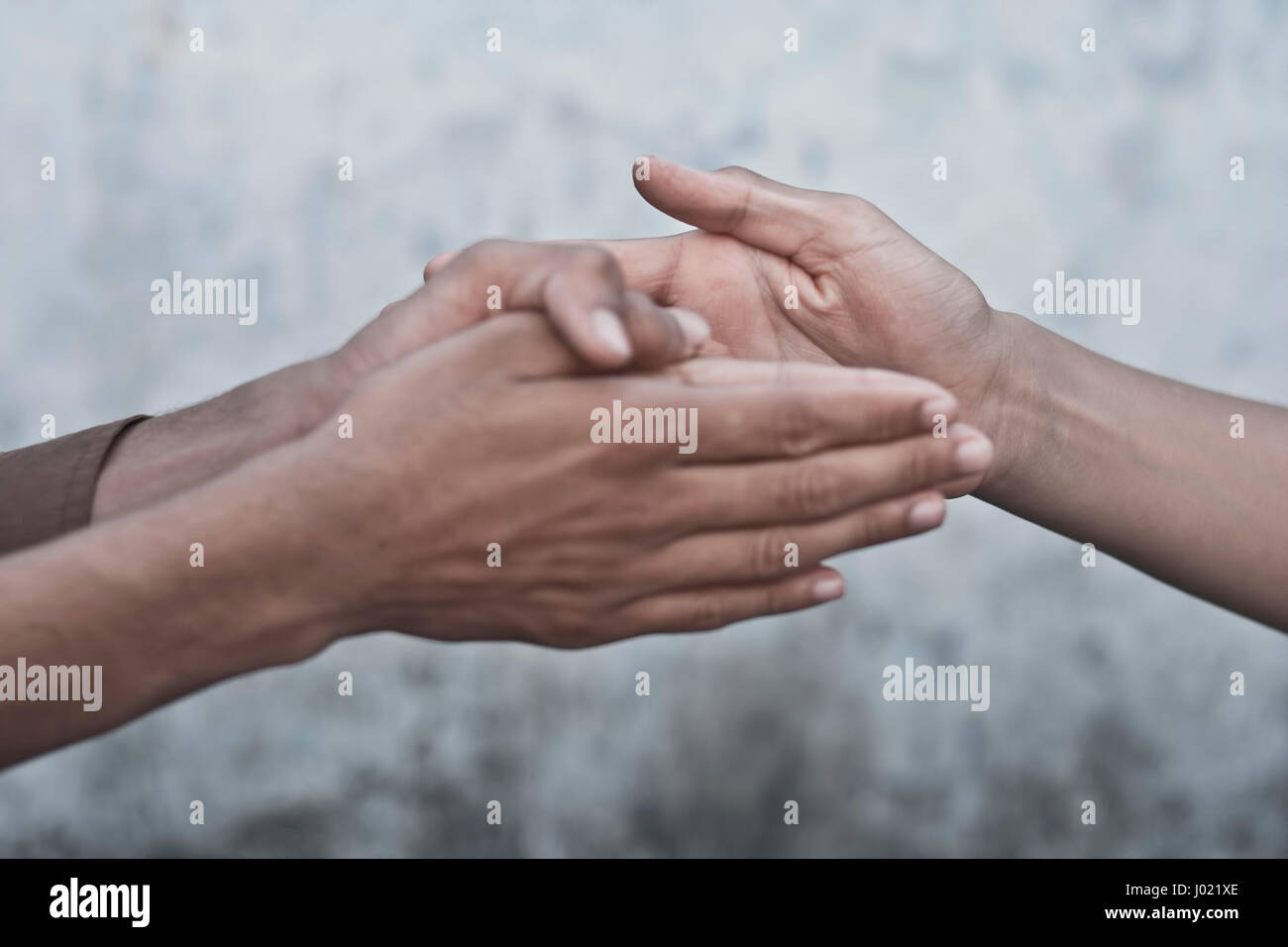 Playing hands of kids Stock Photo - Alamy