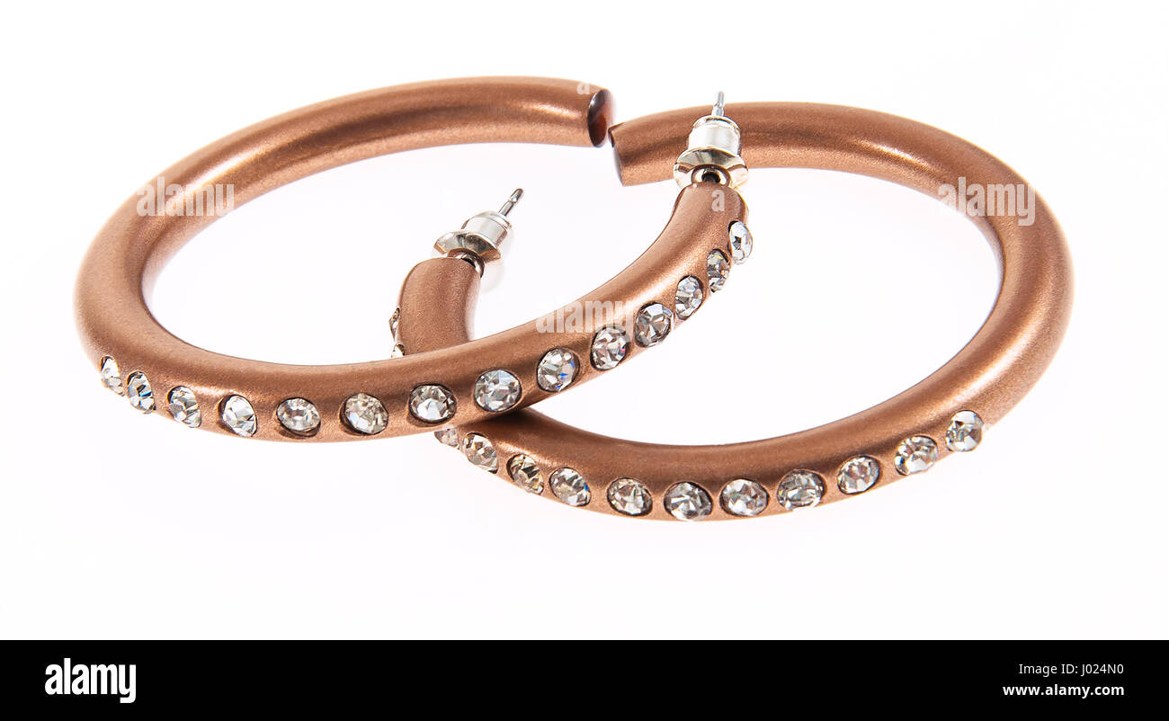 Diamond studded ear ring hoops on white Stock Photo - Alamy