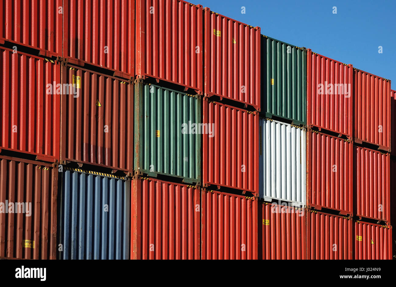 Stacks of shipping containers in port yard Stock Photo - Alamy