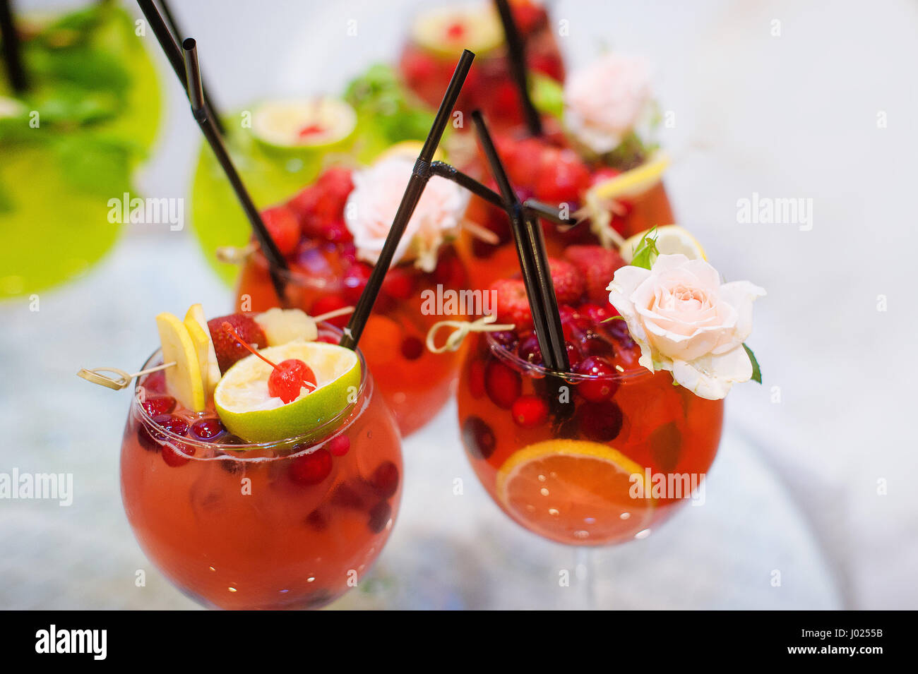 Glasses of cocktails on bar background Stock Photo - Alamy