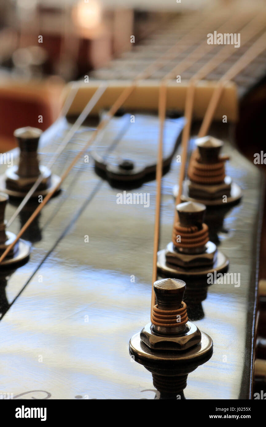 Six string guitar with shallow focus on tuning pegs Stock Photo - Alamy