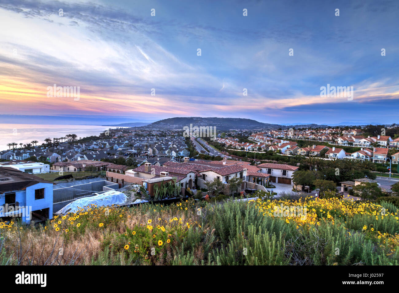 Hiking trail above Dana Point coast and the ocean at sunset in Southern ...