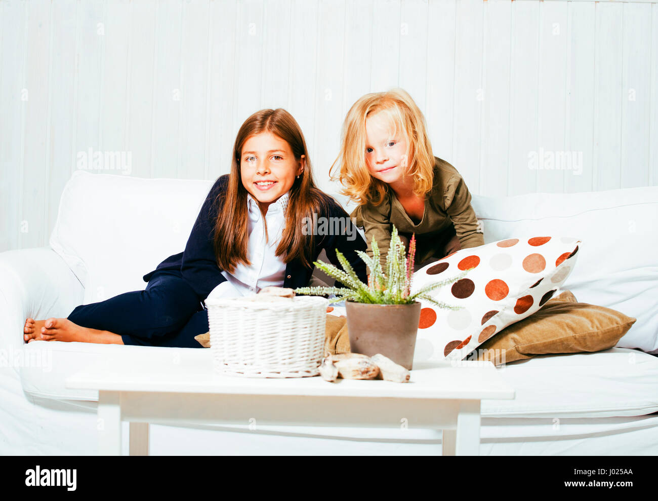 two cute sisters at home playing, little girl in house interior Stock ...