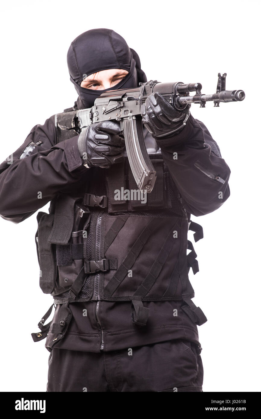 Armed terrorist in black mask and black uniform aiming with a gun Stock ...