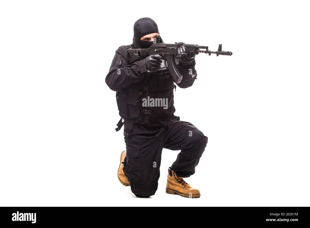 terrorist with machine gun on white background Stock Photo - Alamy