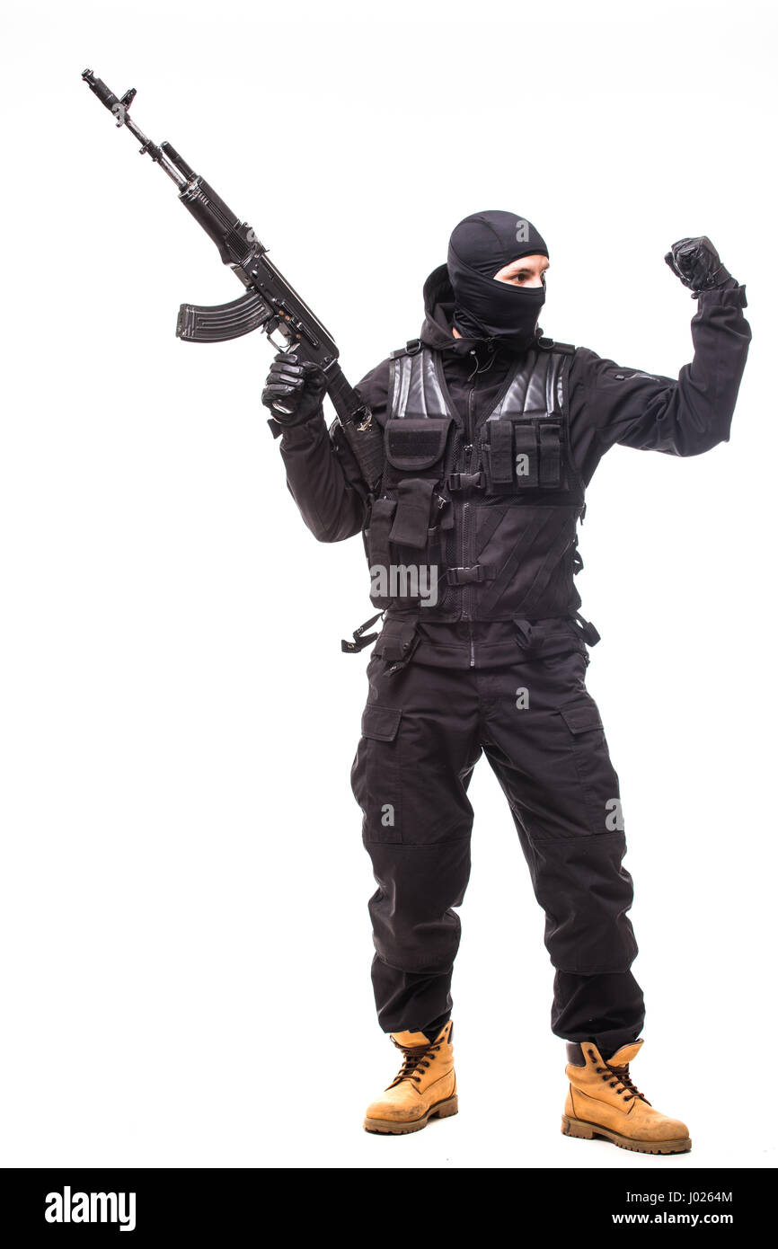 SWAT officer with assault rifle in black uniform isolated on white ...