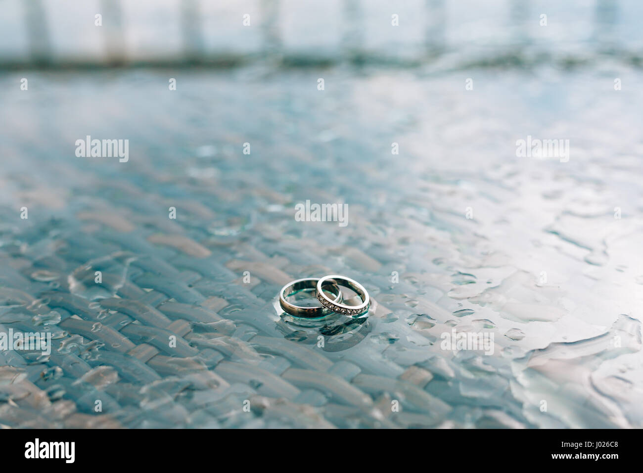 Two wedding rings in rain hi-res stock photography and images - Alamy