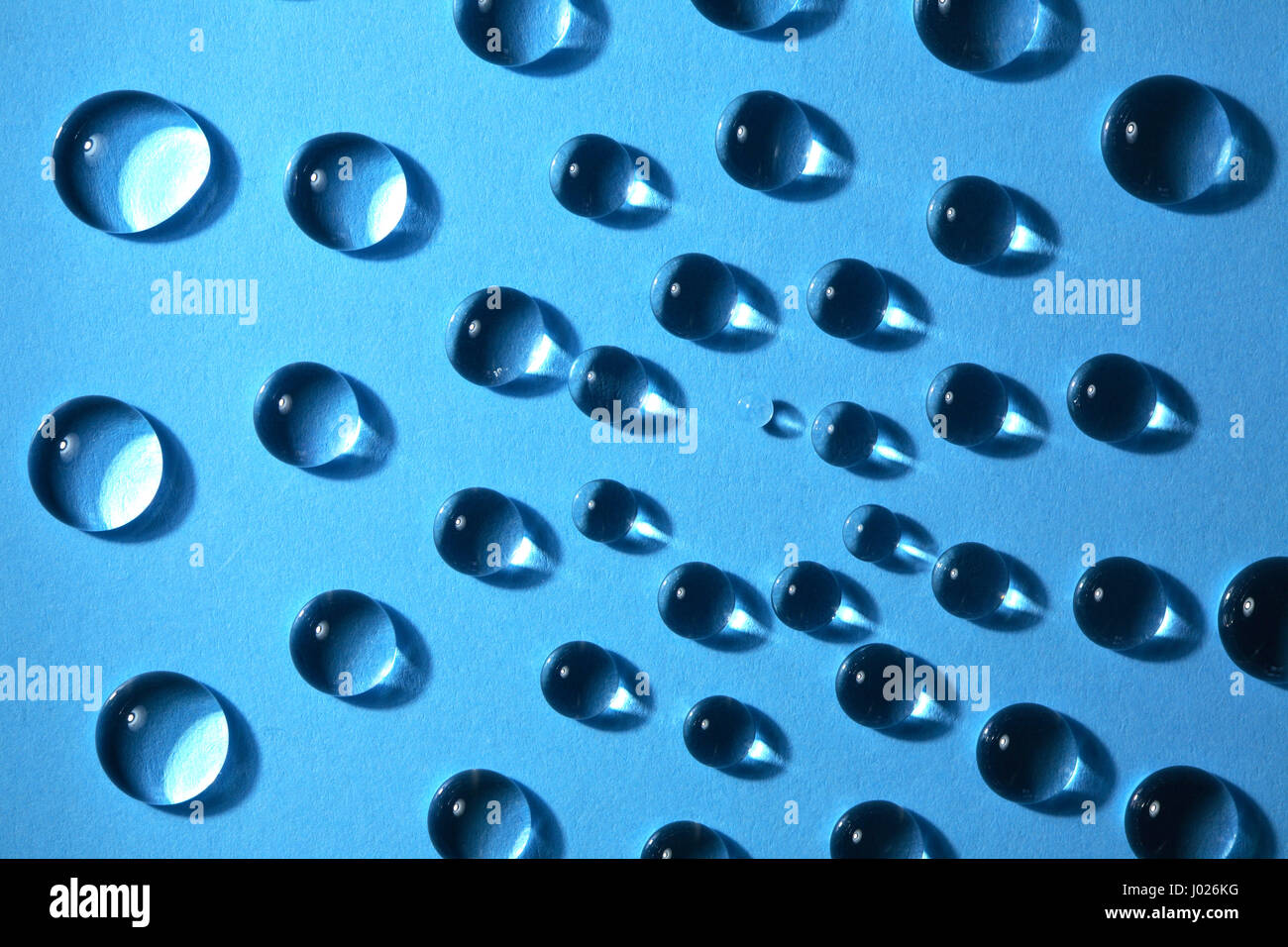 Abstract blue paper background with drops of water Stock Photo - Alamy