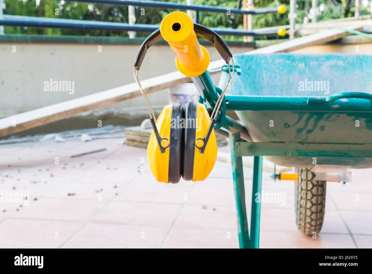 Protective ear muffs. Concept of prevention and safety at work. Yellow ...