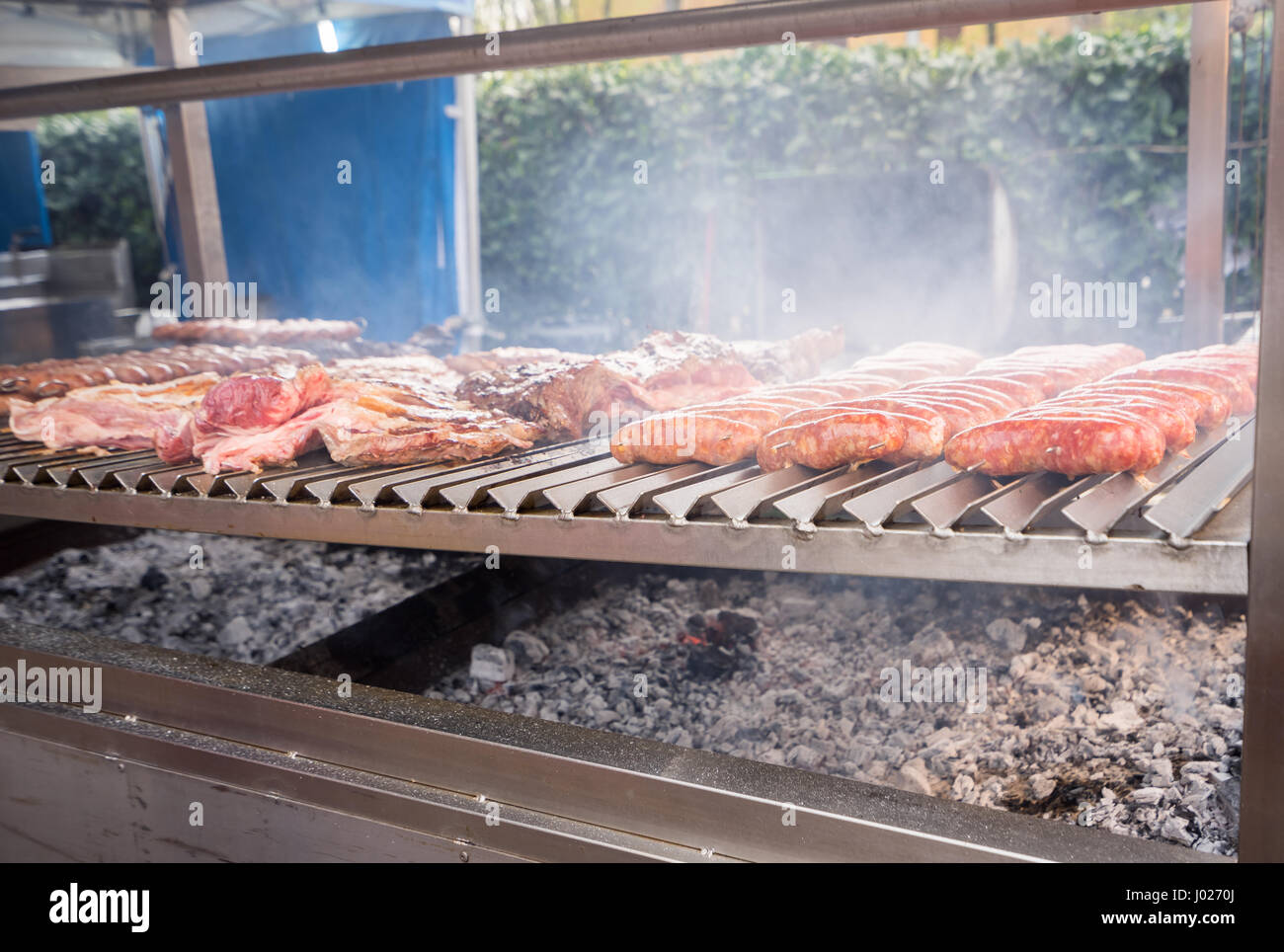 Cooking assorted meat at barbecue outdoor,Shallow depth of field Stock ...