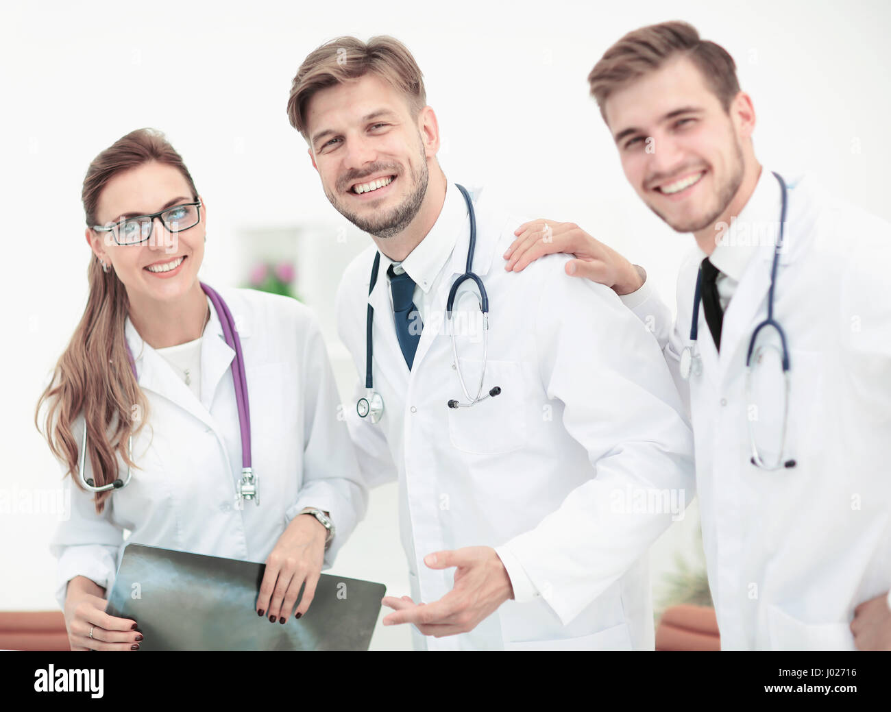 Portrait of group of smiling doctors working together and smili Stock ...