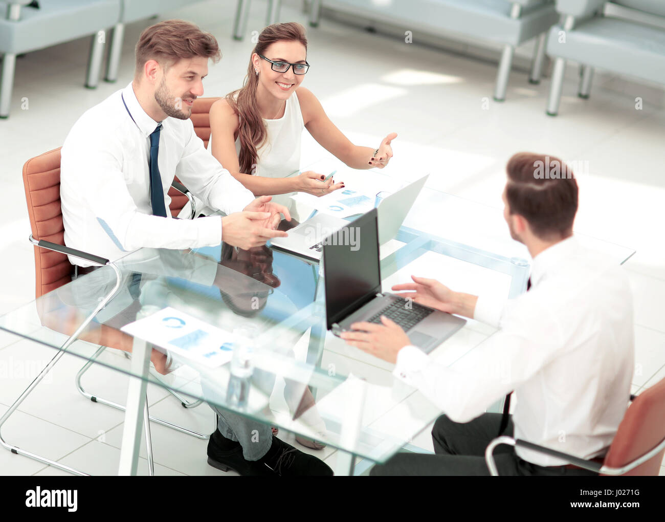 Business people working around table in modern office Stock Photo - Alamy Business people working around table in modern office Stock Photo - Alamy