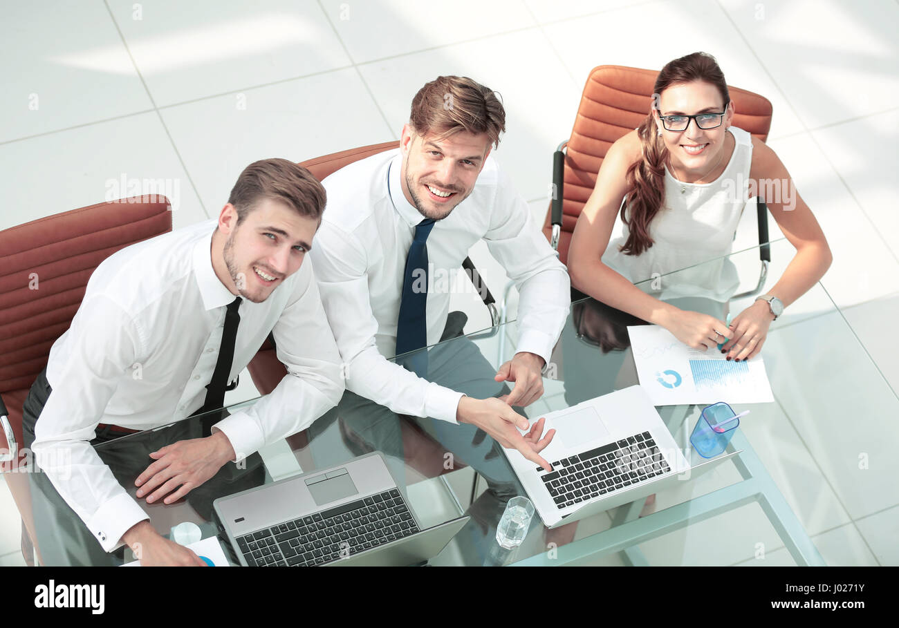 Business people working around table in modern office. Top view Stock ...