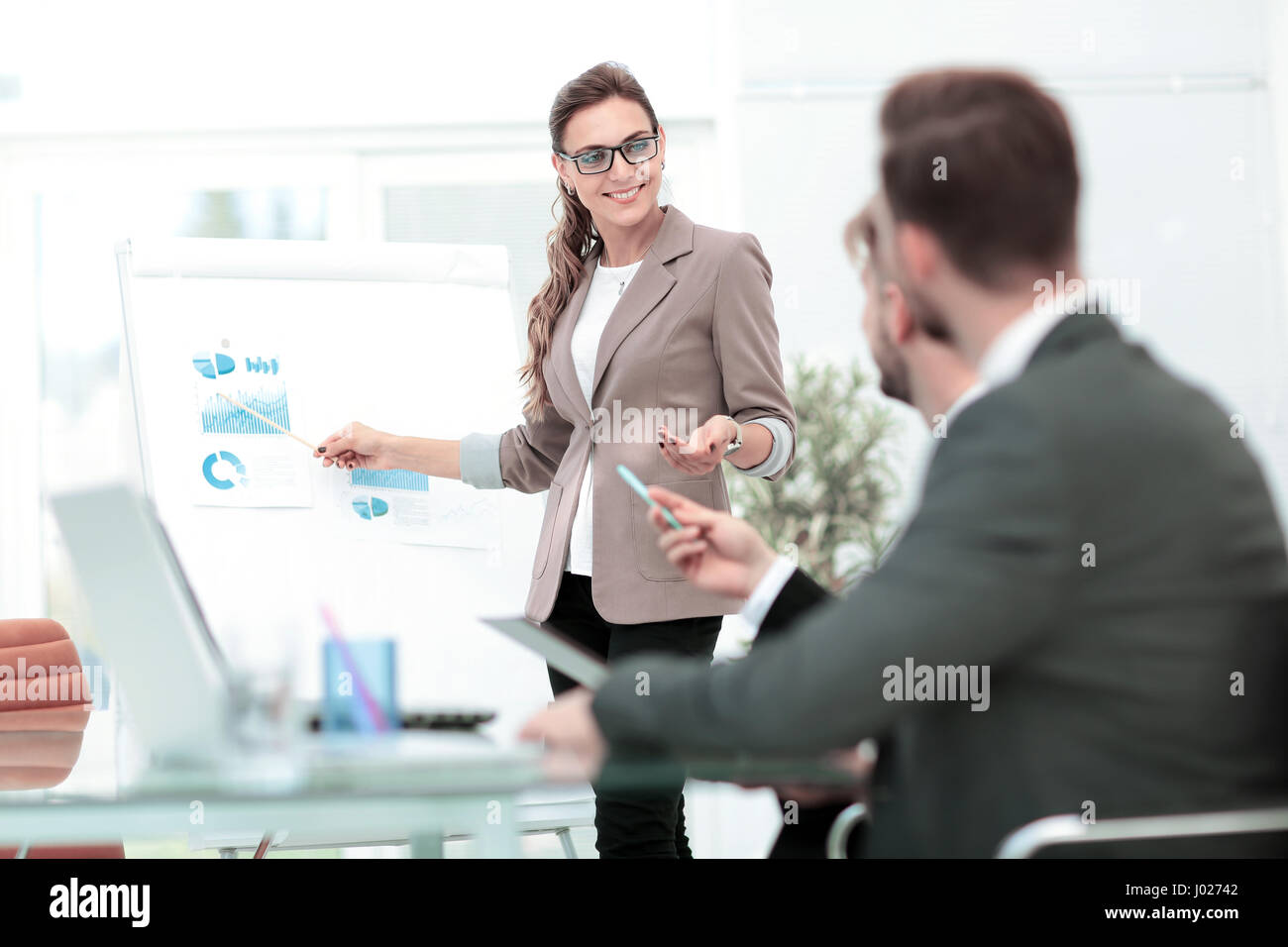 Successful Woman making a business presentation to a group Stock Photo ...