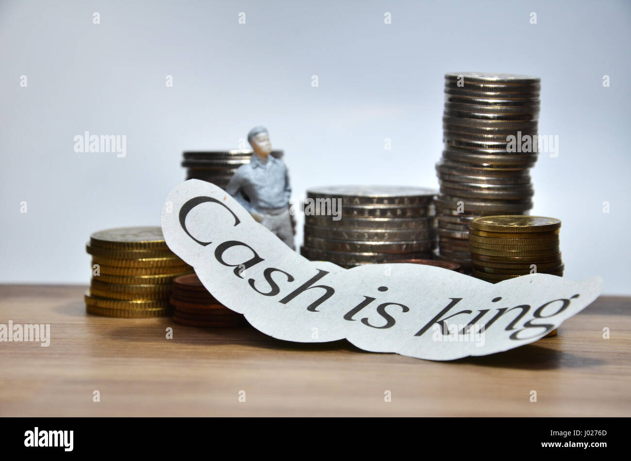 Cash is King words with many coins Stock Photo - Alamy