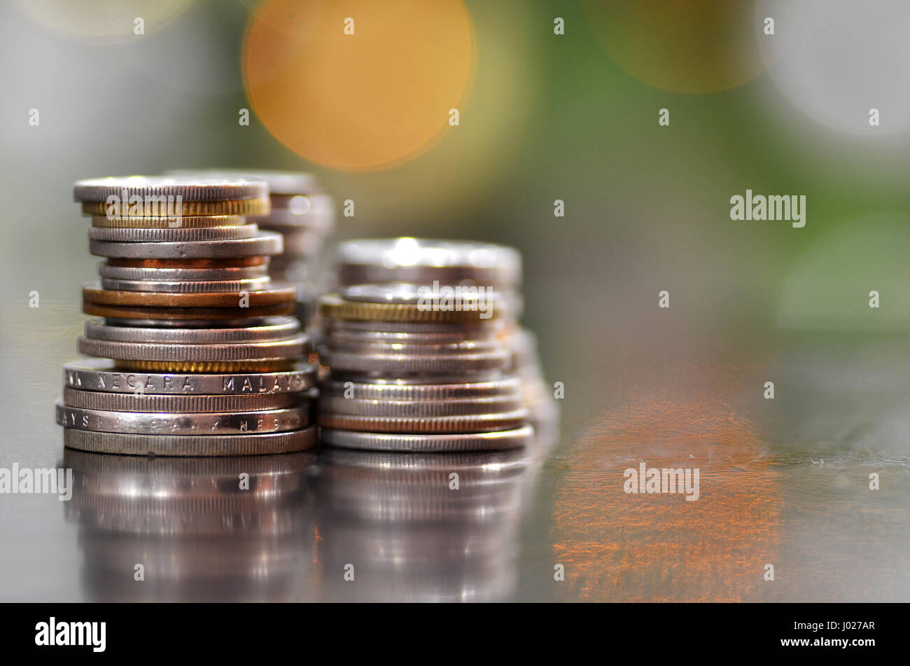 Mixed coins from many countries on wood table Stock Photo - Alamy