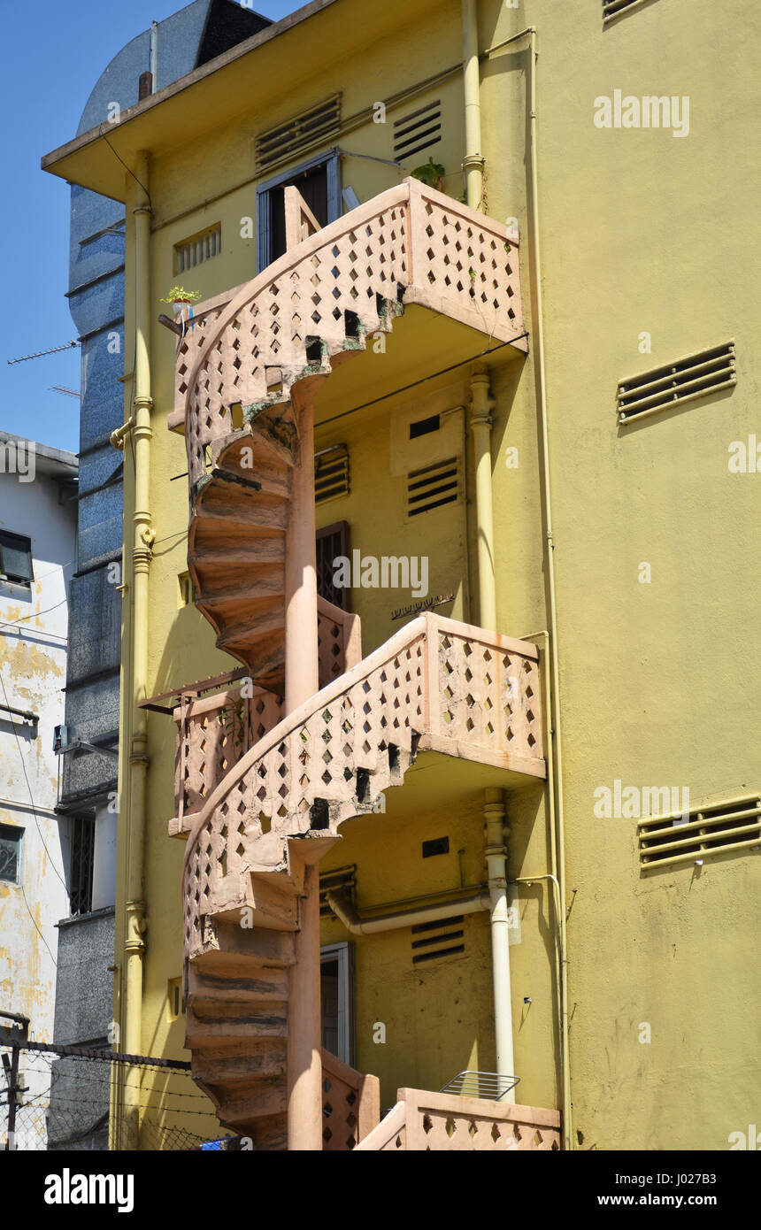 Colorful spiral staircases at the back of traditional chinese shop ...