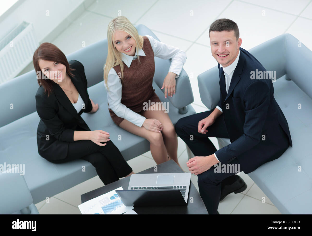 Business people working around table in modern office Stock Photo - Alamy