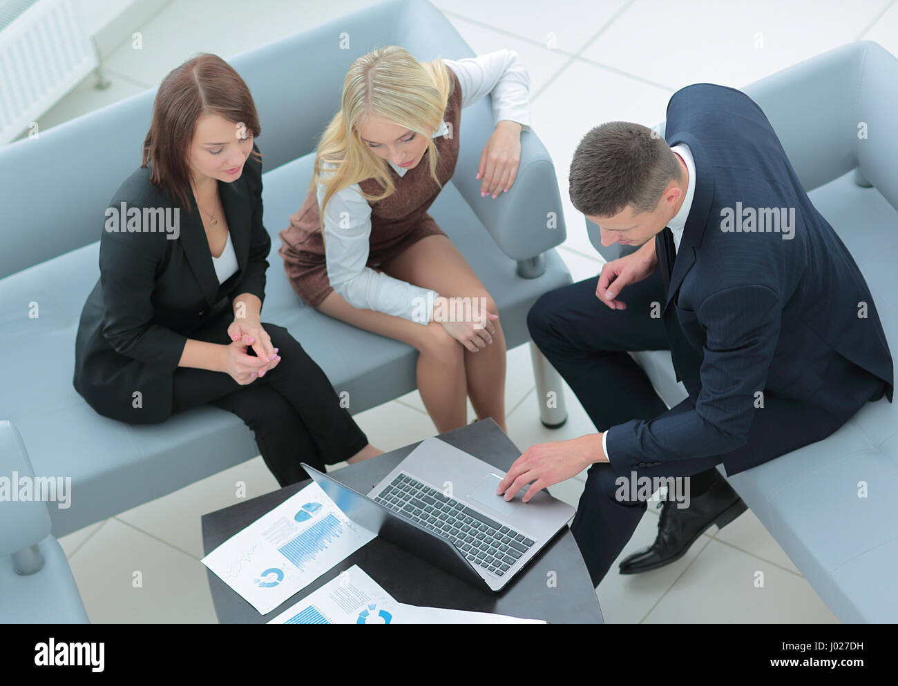 Business people working around table in modern office Stock Photo - Alamy