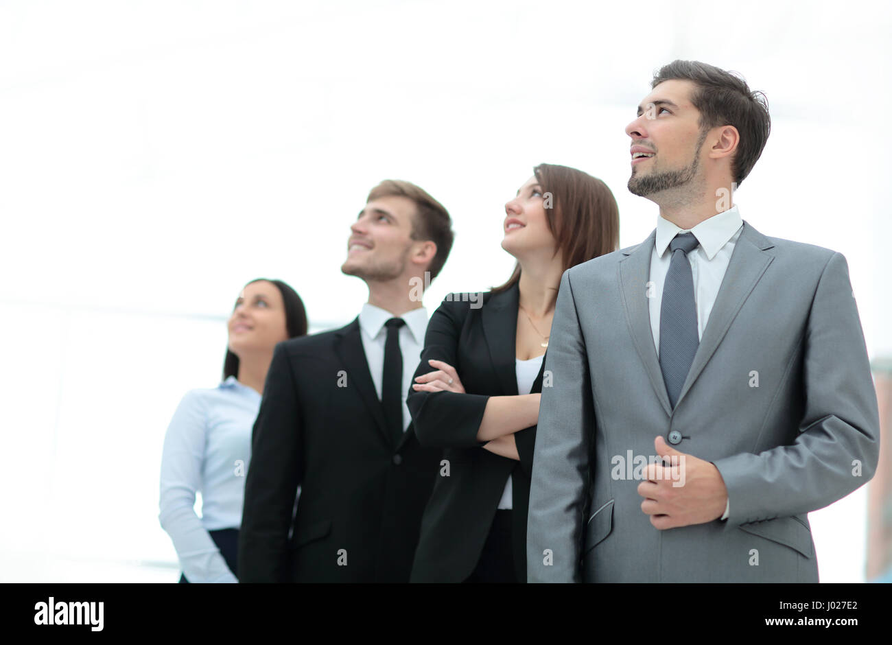 Group of happy and successful business people looking up Stock Photo ...
