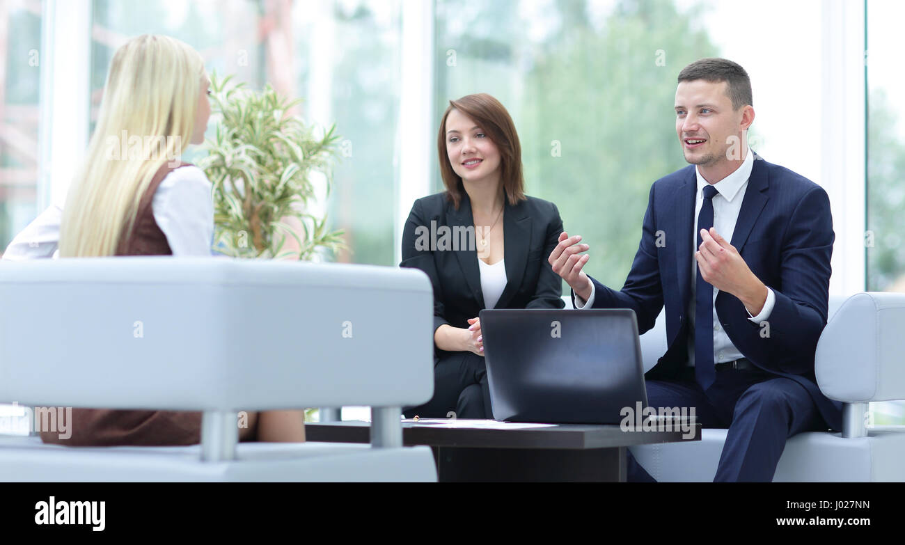 Business people working around table in modern office Stock Photo - Alamy