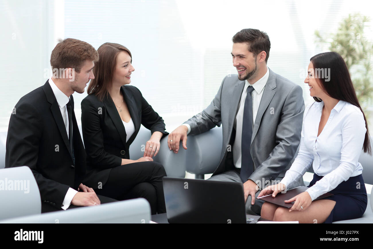 Business people working around table in modern office Stock Photo - Alamy