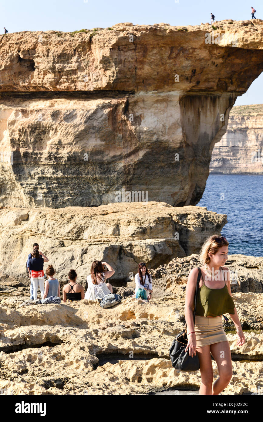 Detail of Azure Window Natural Rock Arch with tourists - Malta Stock ...