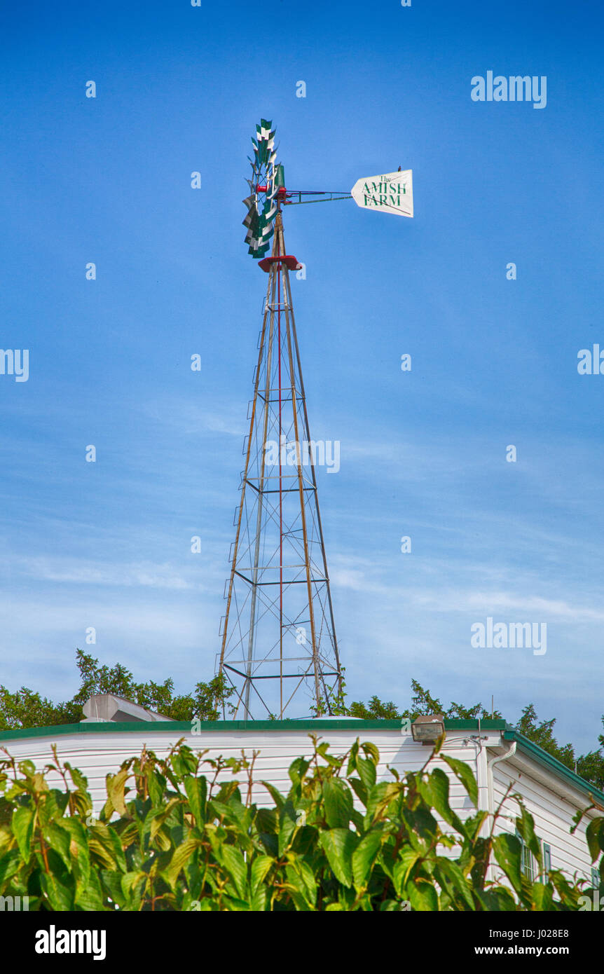 A traditional windmill powering a grain mill in Amish Country ...