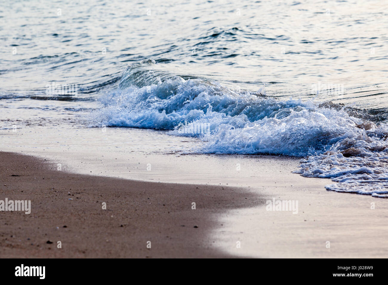 Sand beach and wave Stock Photo - Alamy