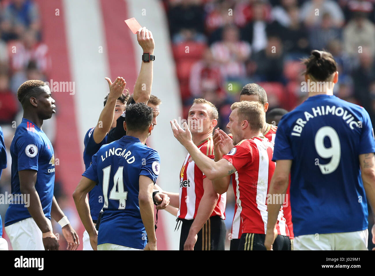 Sunderland's Sebastian Larsson (right) receives a red card during the ...