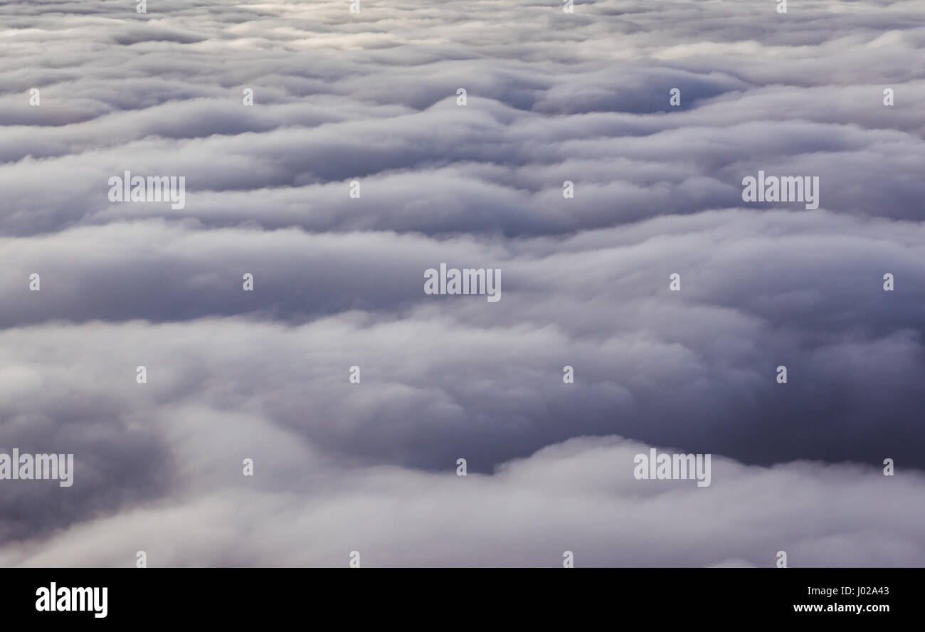Clouds seen from plane window Stock Photo - Alamy