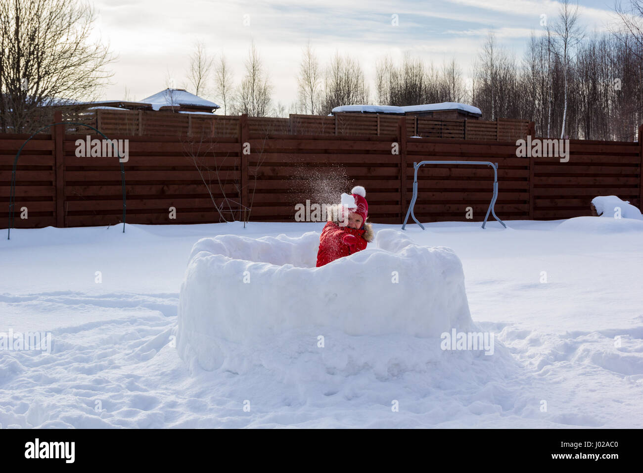 Happy kids playing snowball fight hi-res stock photography and images ...